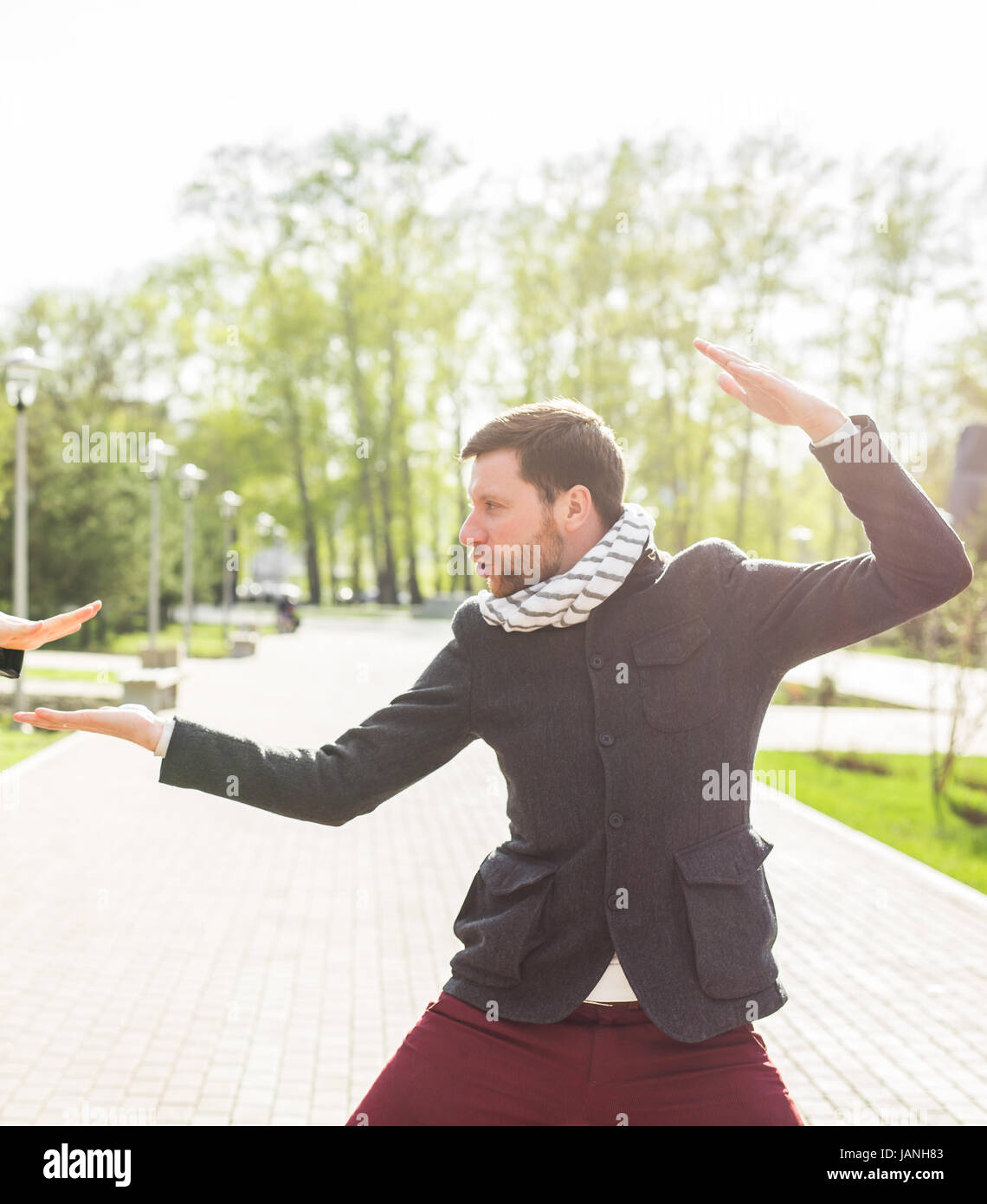 Man fool around in pose of samurai outdoors Stock Photo - Alamy