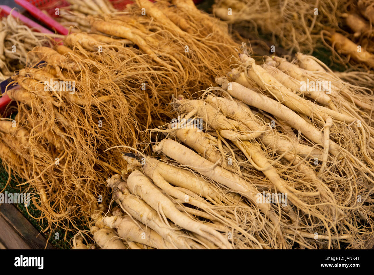 Fresh ginseng in food market Stock Photo - Alamy
