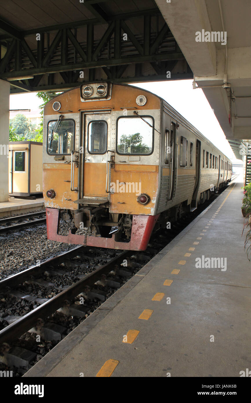 Yellow train engine and rail track Stock Photo - Alamy