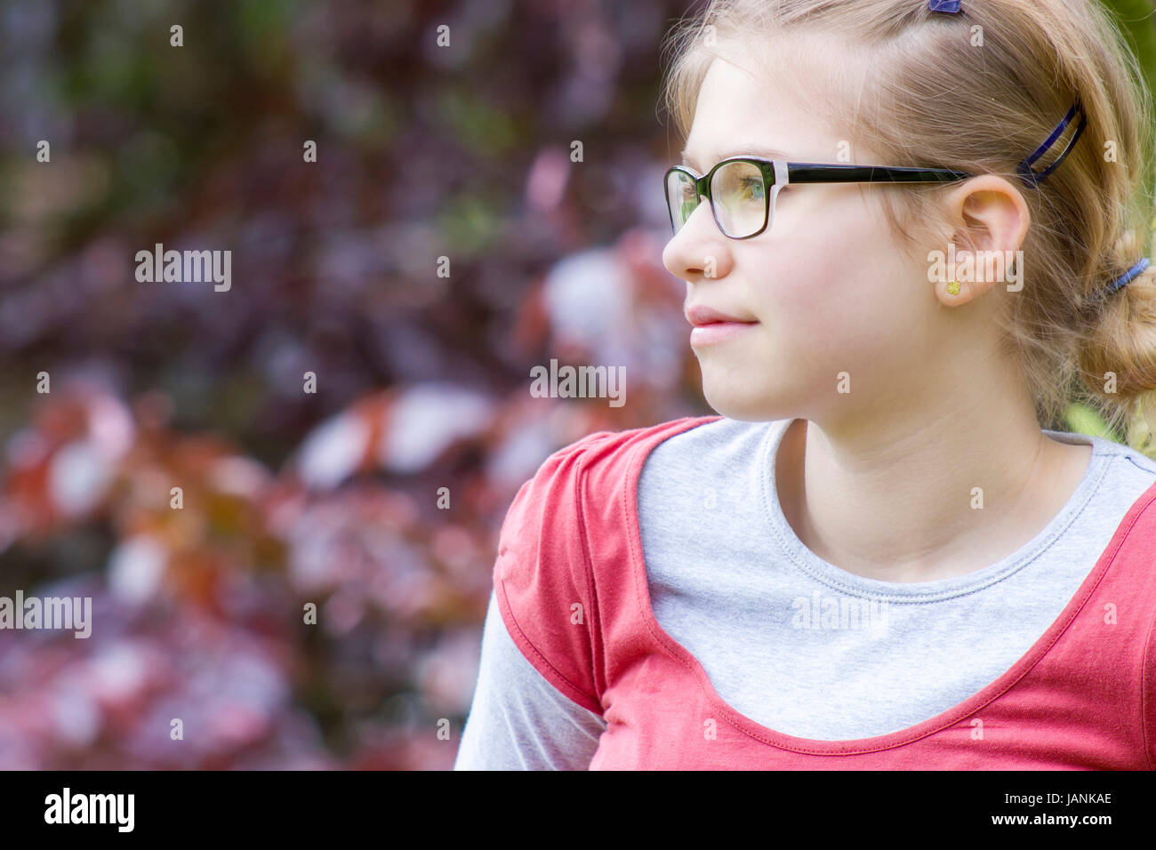 Young girl in park in spring day - portrait Stock Photo - Alamy