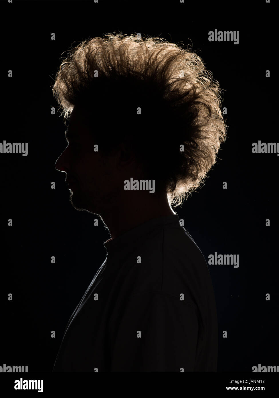 profile of man in black shadow on black background Stock Photo - Alamy