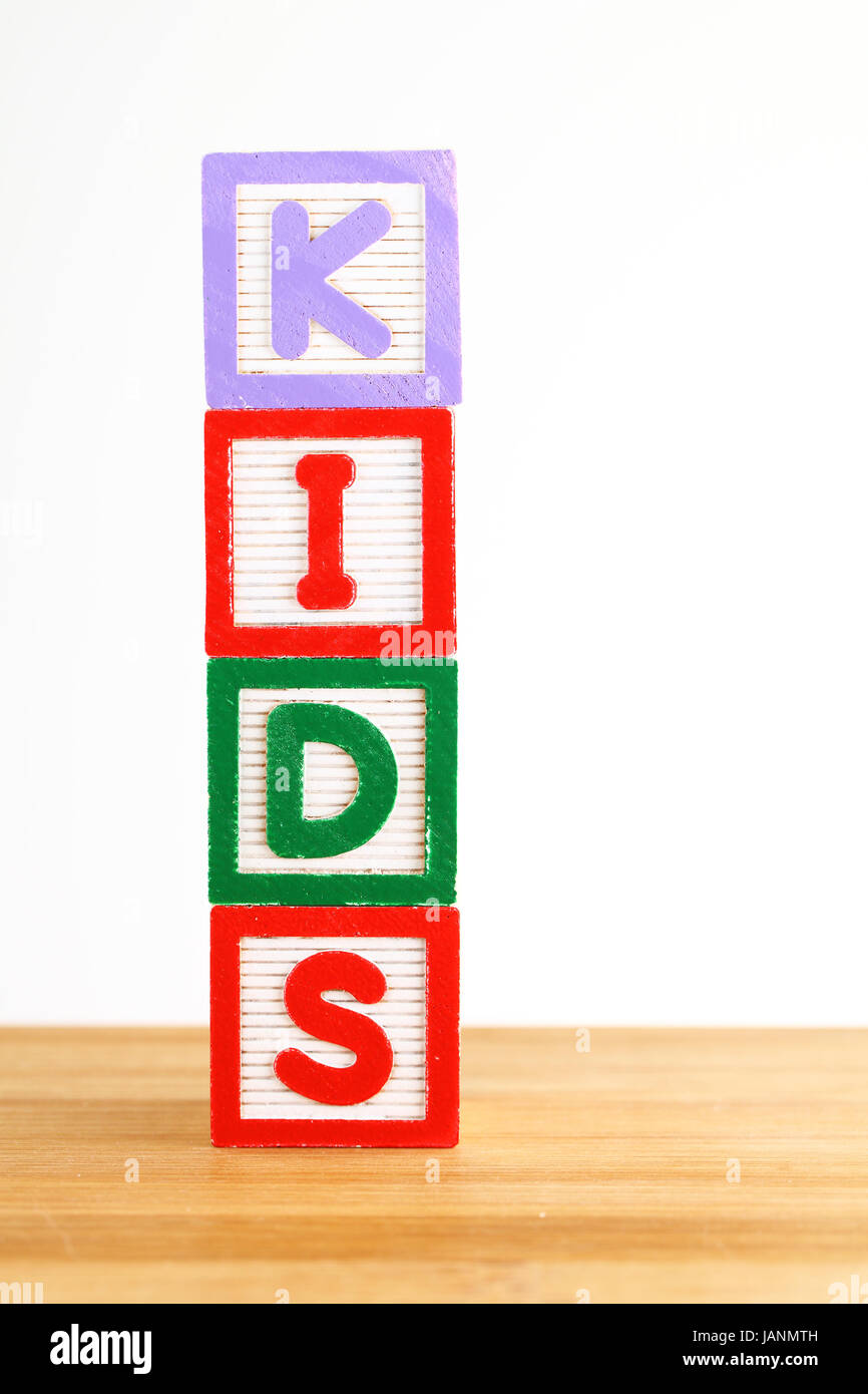 Alphabet building blocks that spelling the word kids Stock Photo - Alamy