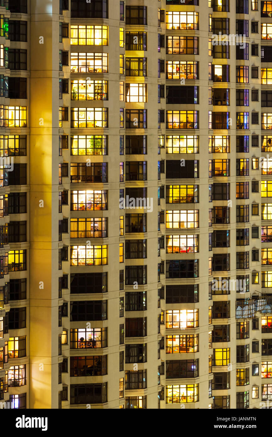 Exterior of apartment building at night Stock Photo - Alamy