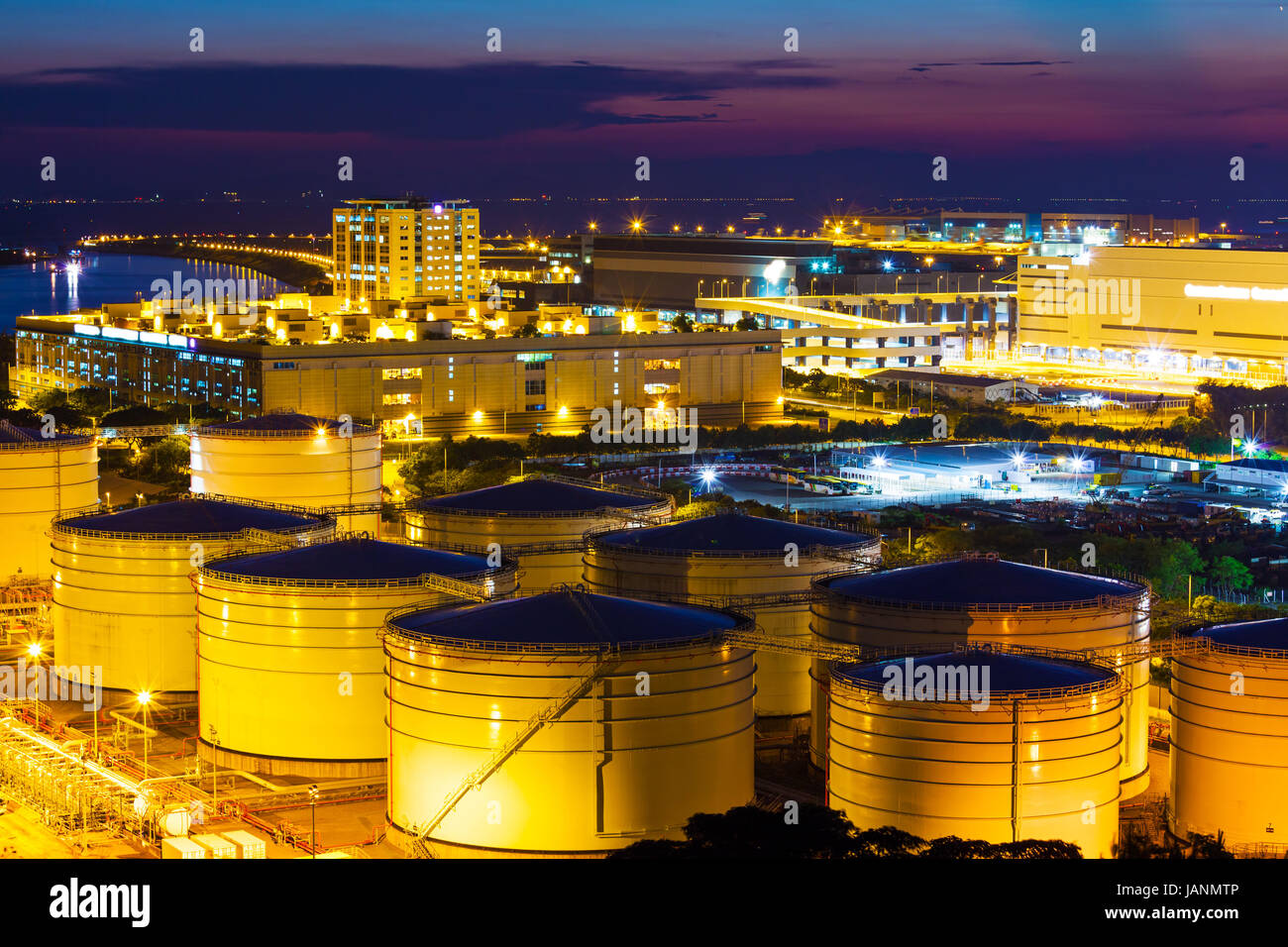 Oil tanks plant during sunset Stock Photo - Alamy