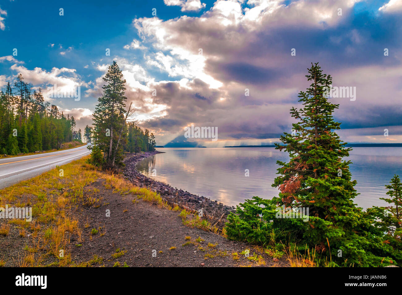 Rays of morning light illuminate Yellowstone Lake Stock Photo - Alamy