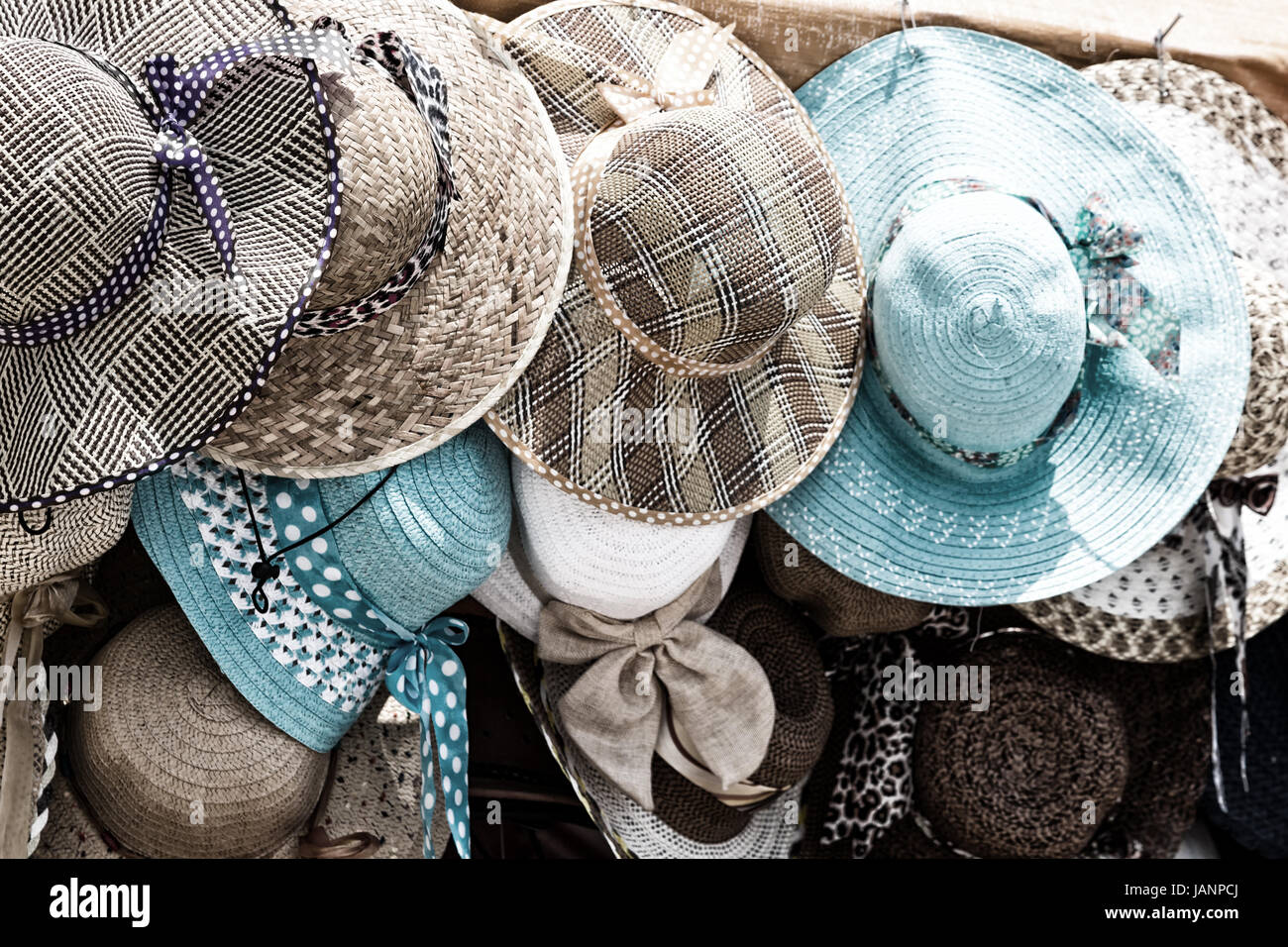 in a old market lots of colorated hats like background clothes Stock ...