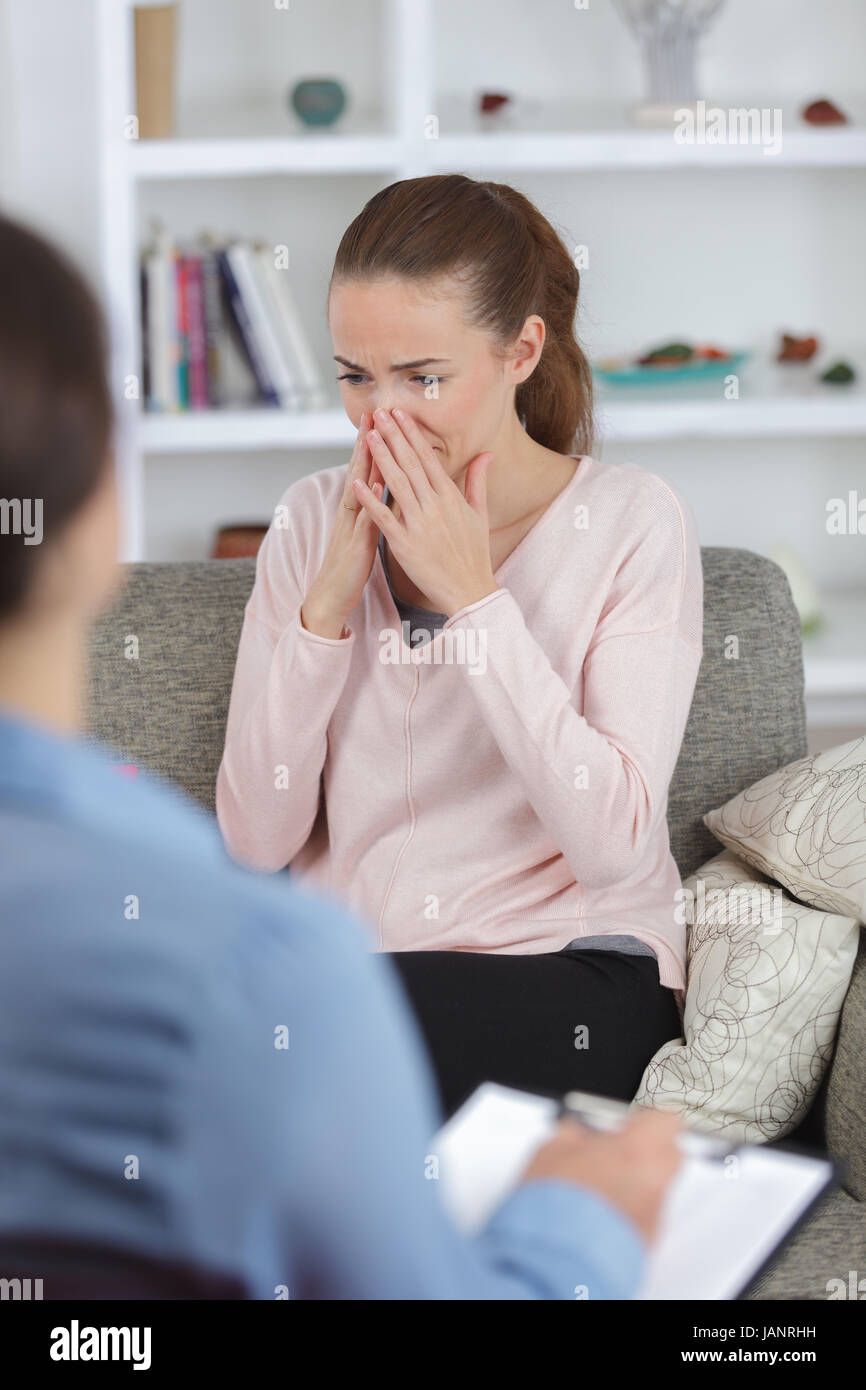 sad girl with psychologist Stock Photo - Alamy