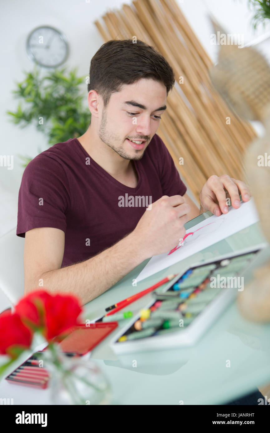 man drawing a sketch at home Stock Photo - Alamy