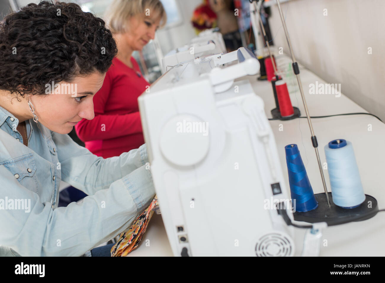 female worker on a sewing machine Stock Photo - Alamy