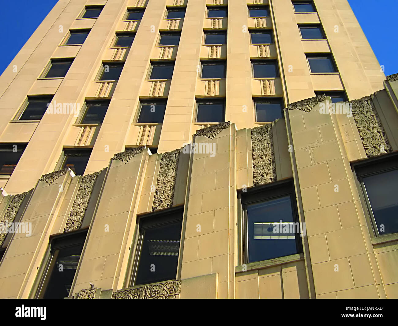 A photograph of a skyscraper detailing its architecture and window ...