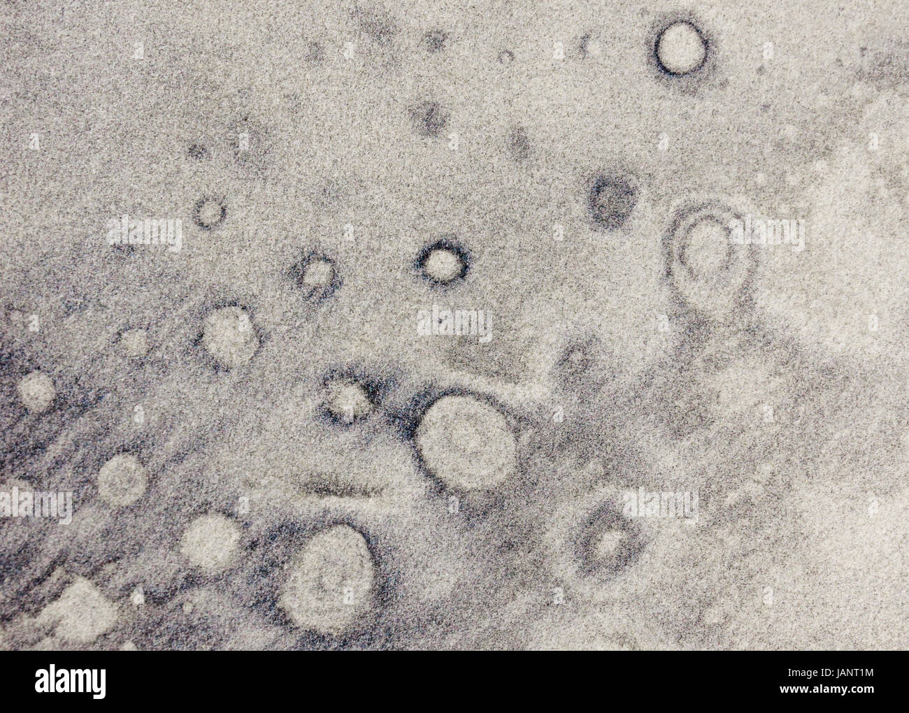 Nature drawing bubble like pattern on sand beach background Stock Photo ...