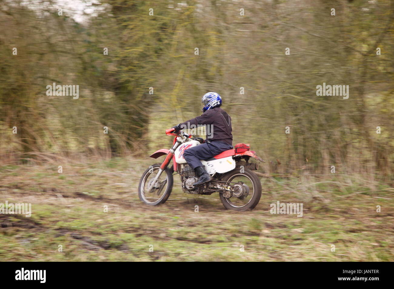 Riding a Honda 600XR motorcycel off-road in the mud Stock Photo - Alamy