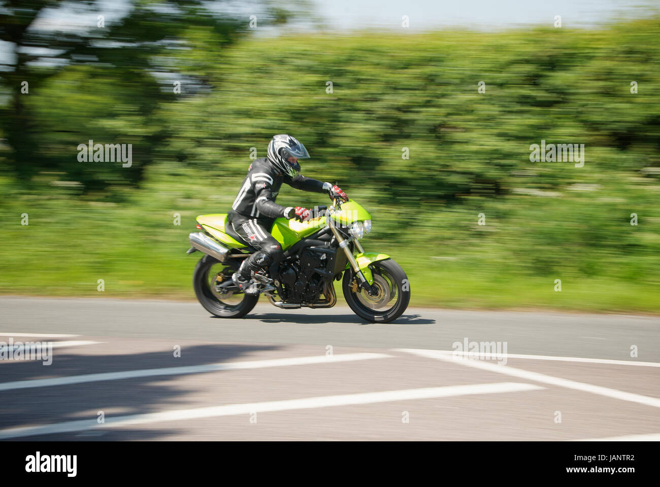 Rider on a Triumph Street Triple motorcycle with motion blur Stock ...