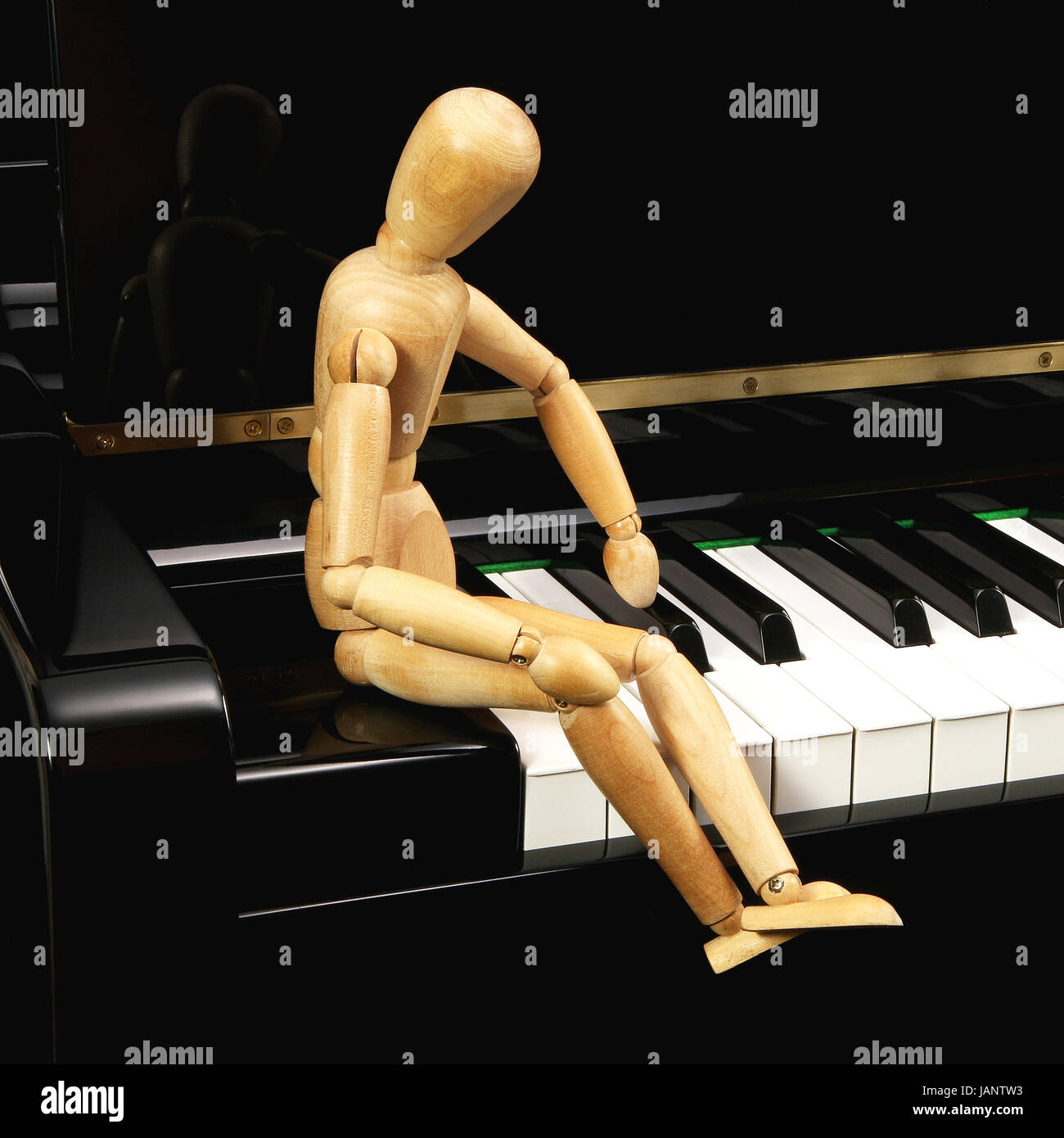 Puppet sit on pianos keyboard Stock Photo - Alamy