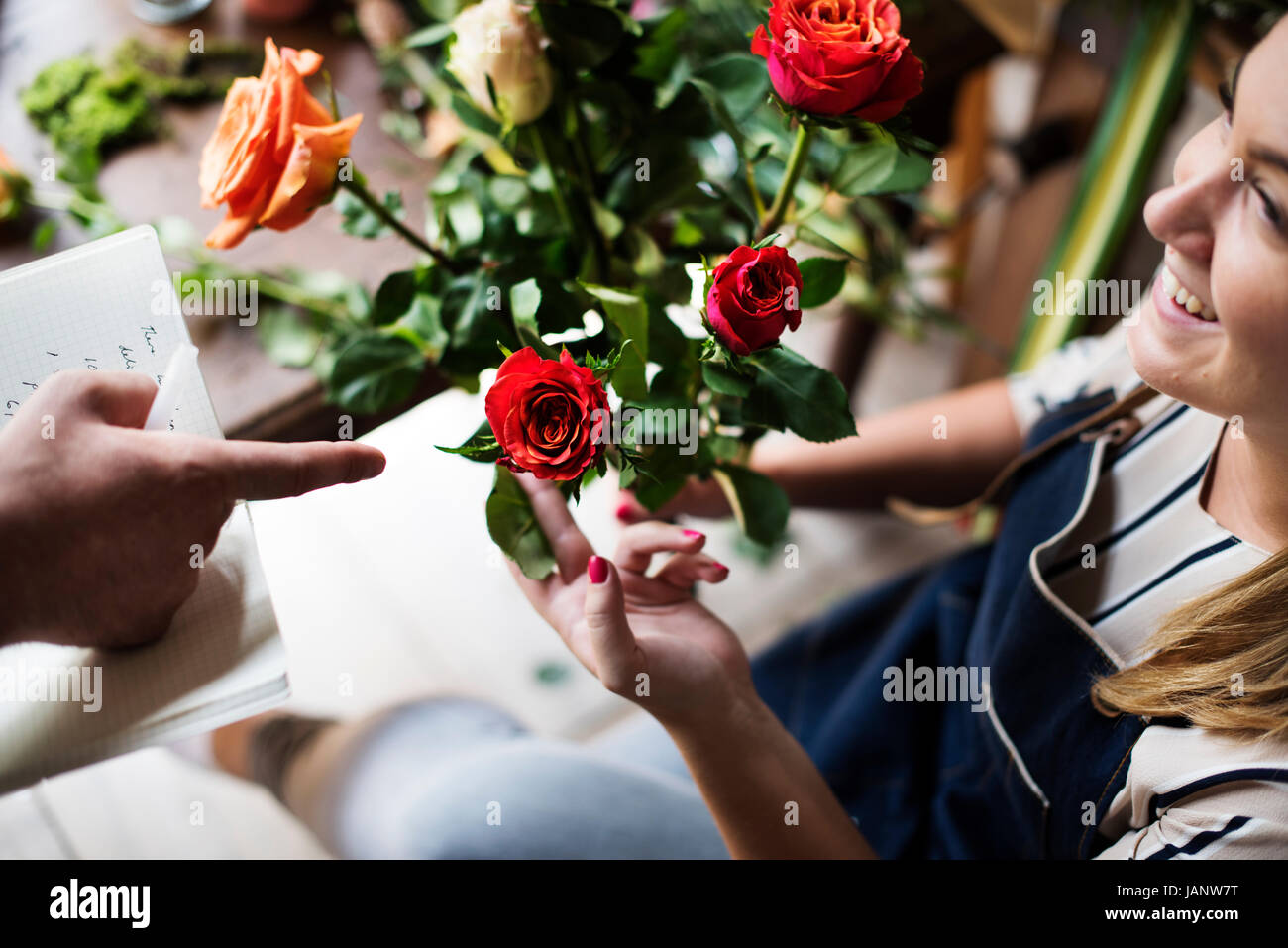 Flowerist working in the flower shop vintage style Stock Photo - Alamy