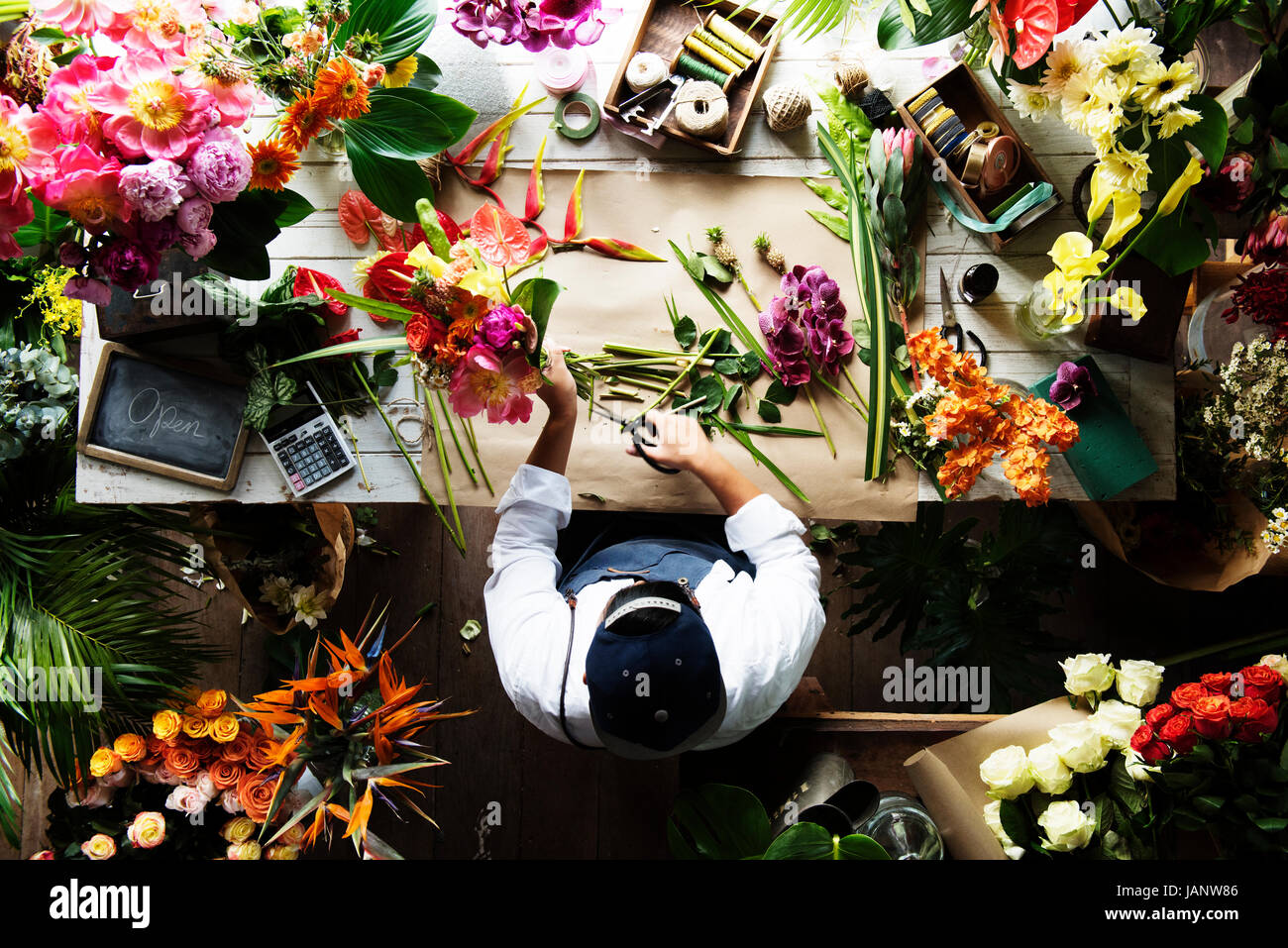 Flower shop business owner working service Stock Photo - Alamy