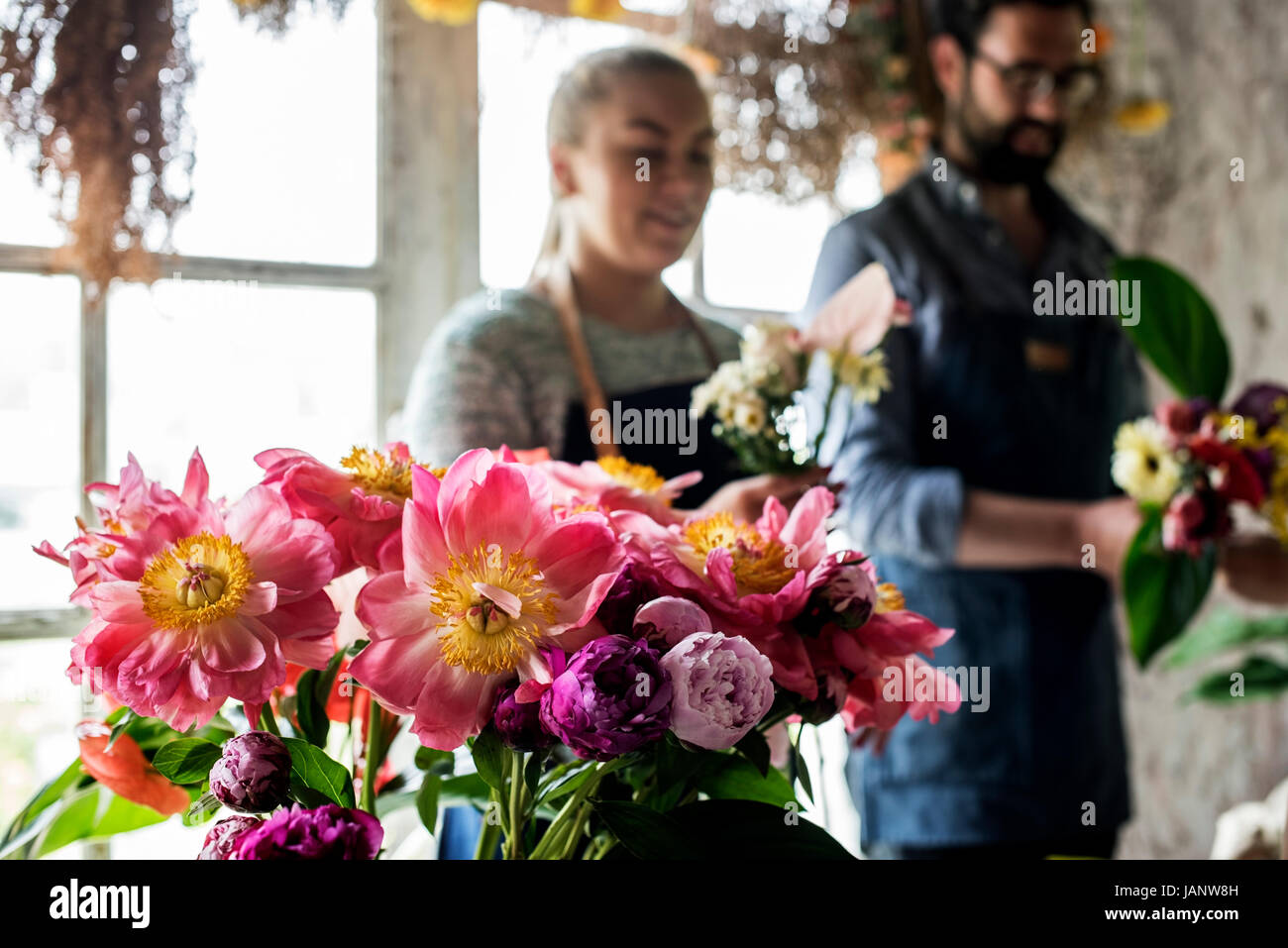 Flower shop business owner working service Stock Photo - Alamy