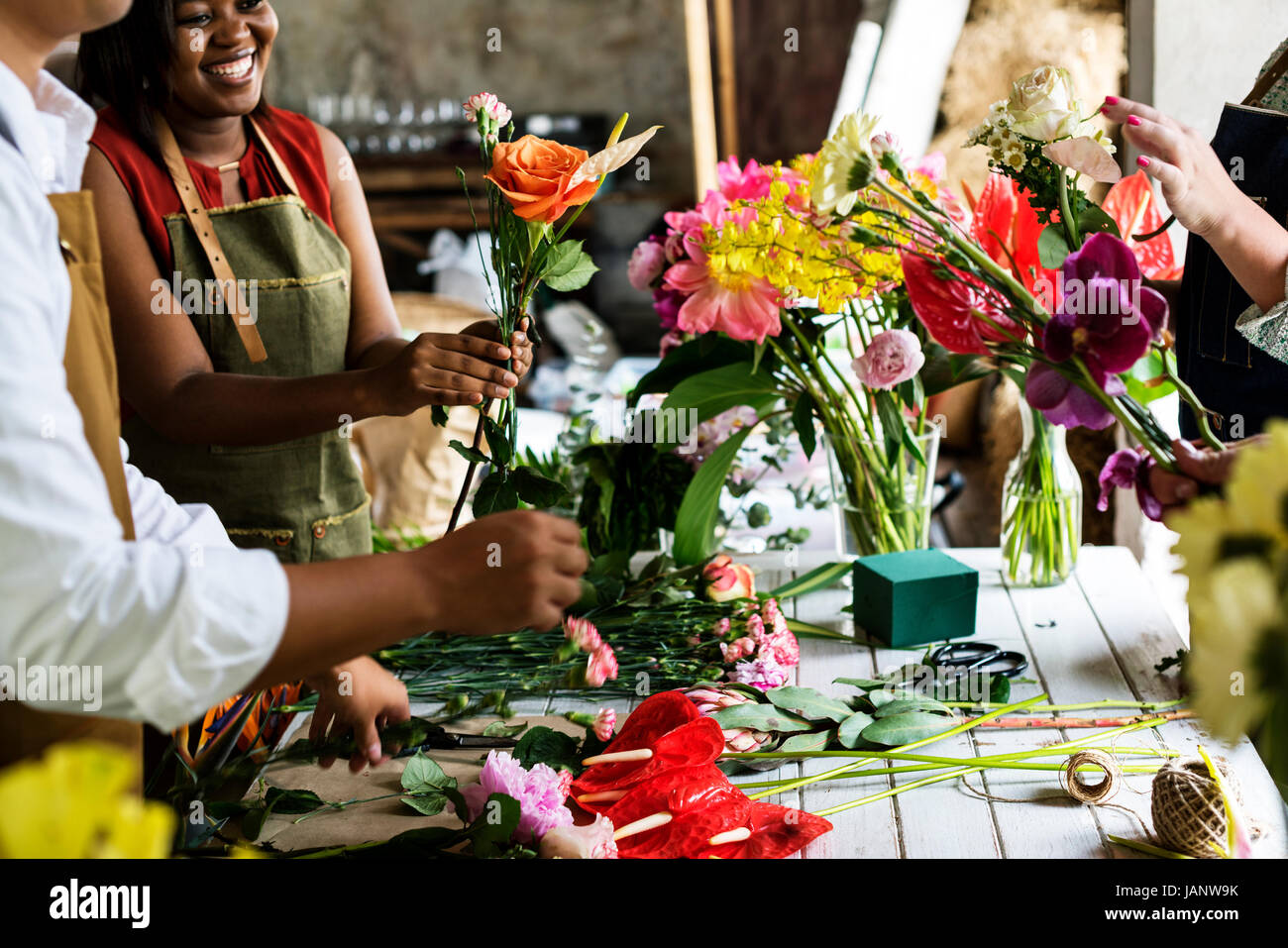 Flower shop business owner working service Stock Photo - Alamy