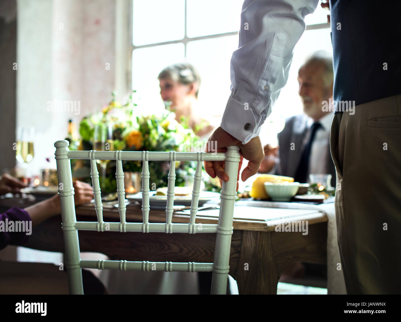 Man Hand on Chair Gathering with Friends Stock Photo - Alamy