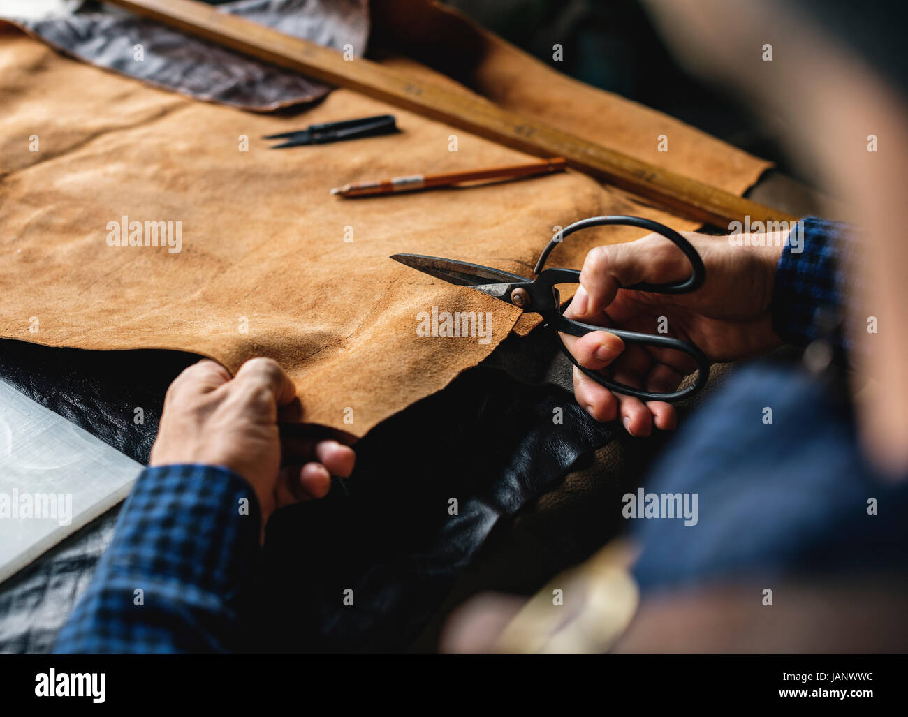 Cutting leather hi-res stock photography and images - Alamy