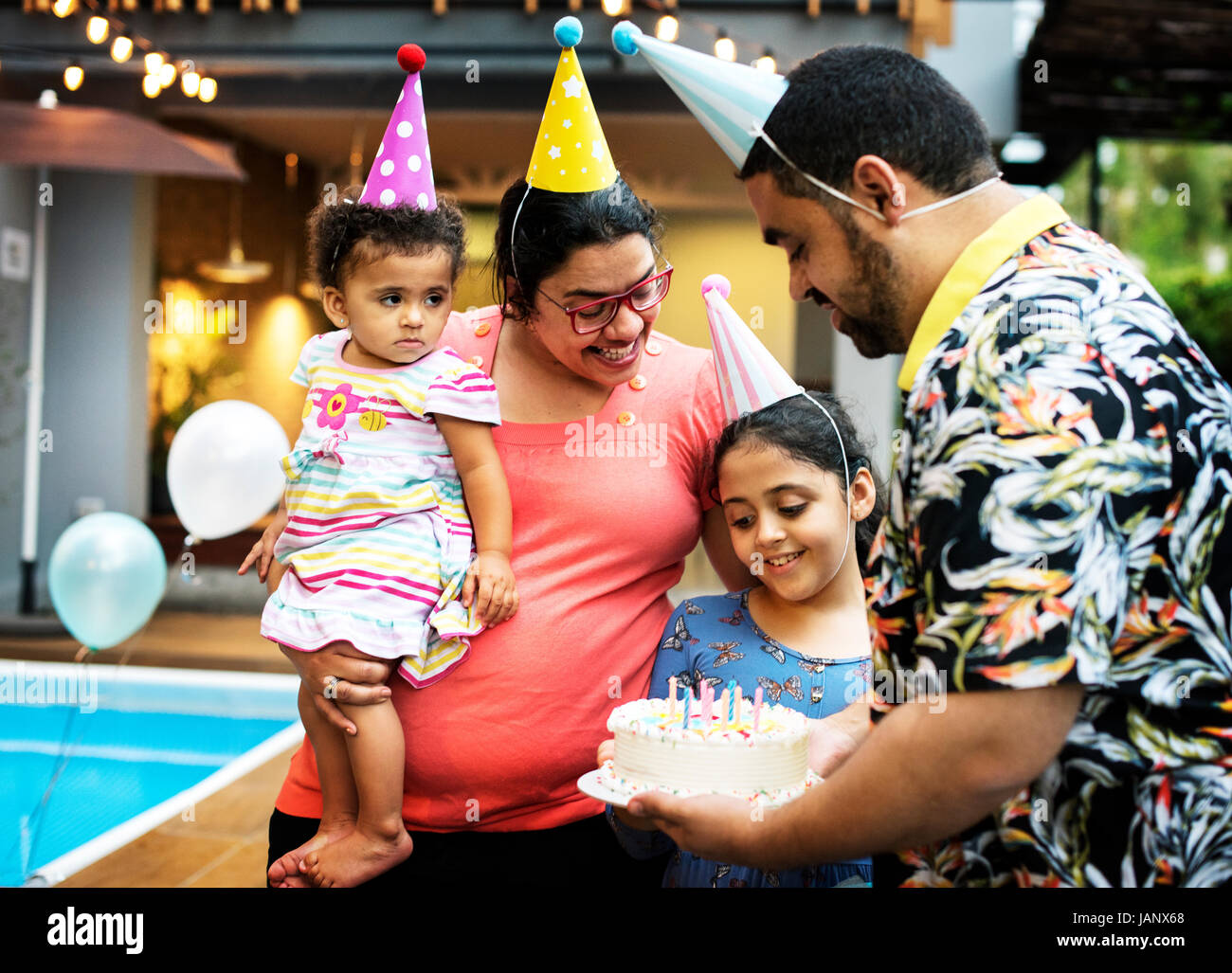 Brazilian family enjoying daughter birthday party Stock Photo - Alamy