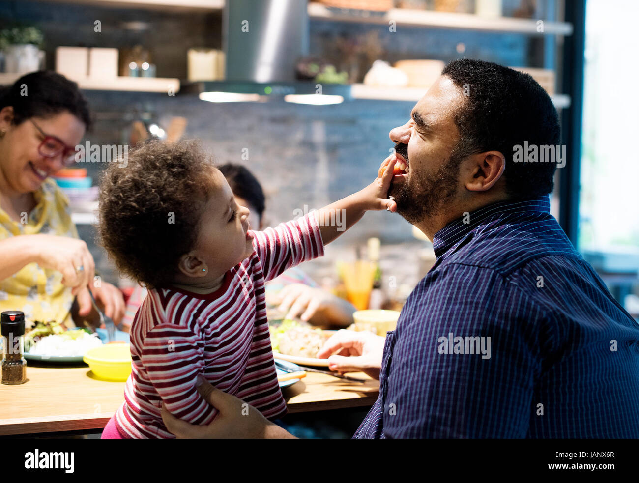 Brazilian family at dining table together Stock Photo - Alamy