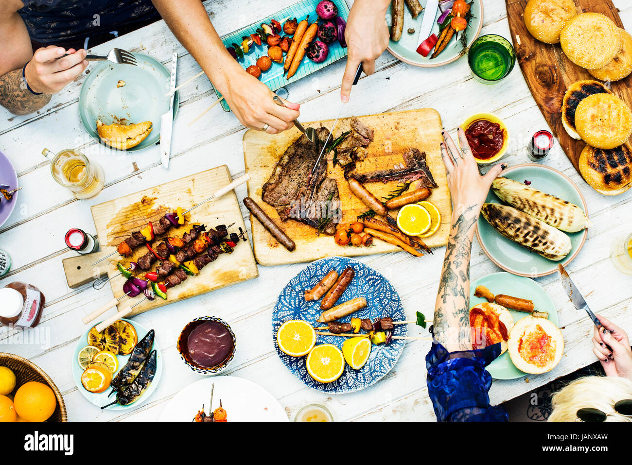 Aerial view of diverse friends gathering having food together Stock ...