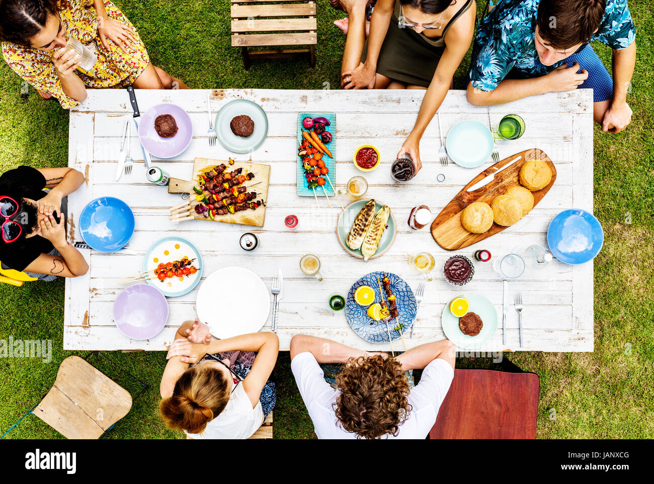 Aerial view of diverse friends gathering having food together Stock ...