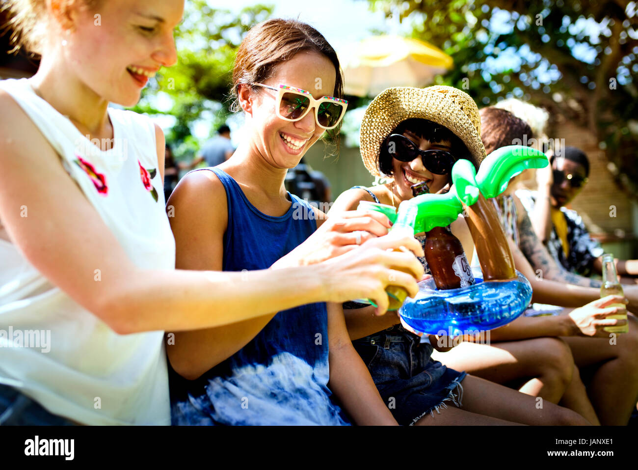 Group of diverse friends celebrating drinking beers together Stock ...