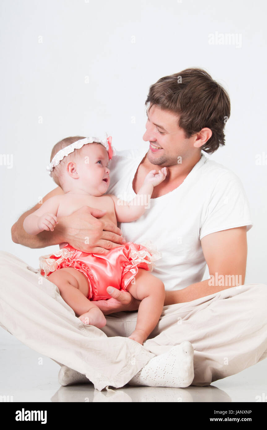 Games with Dad, father throw up baby daughter in arms Stock Photo - Alamy