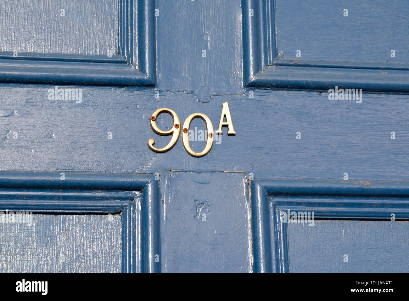 House number 90A sign on wooden door Stock Photo - Alamy