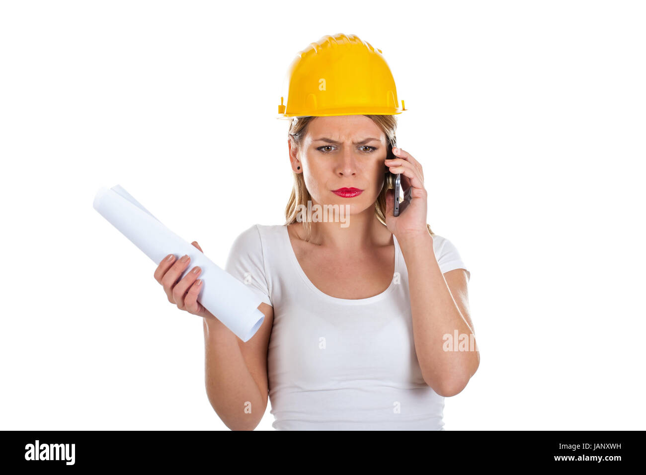 Picture of an upset female engineer talking on the phone Stock Photo ...