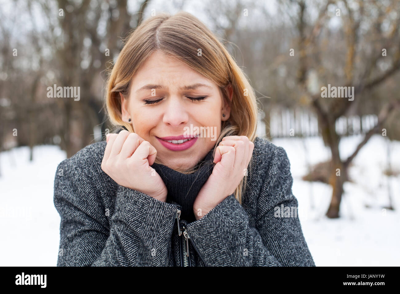 Picture of a freezing young woman outdoor Stock Photo - Alamy