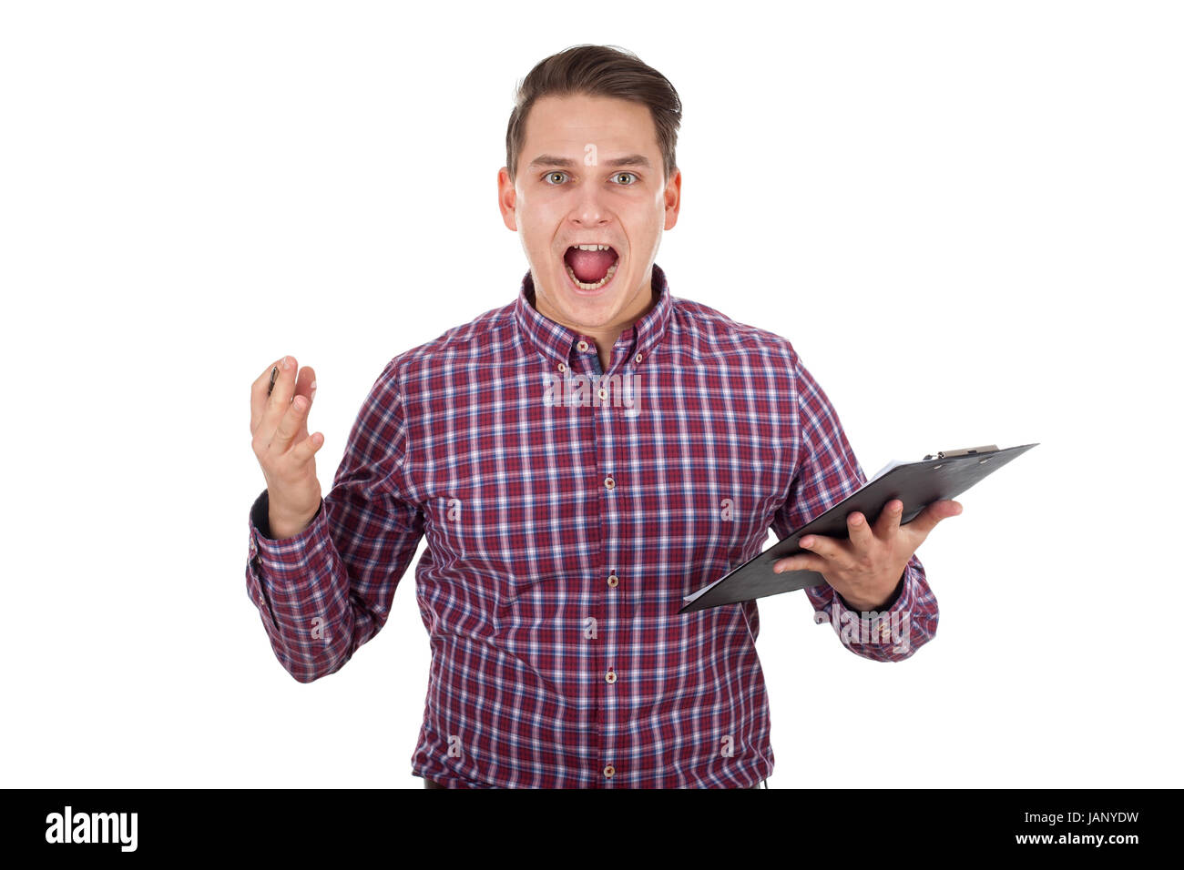 Picture of an angry young man screaming while doing paperwork Stock ...