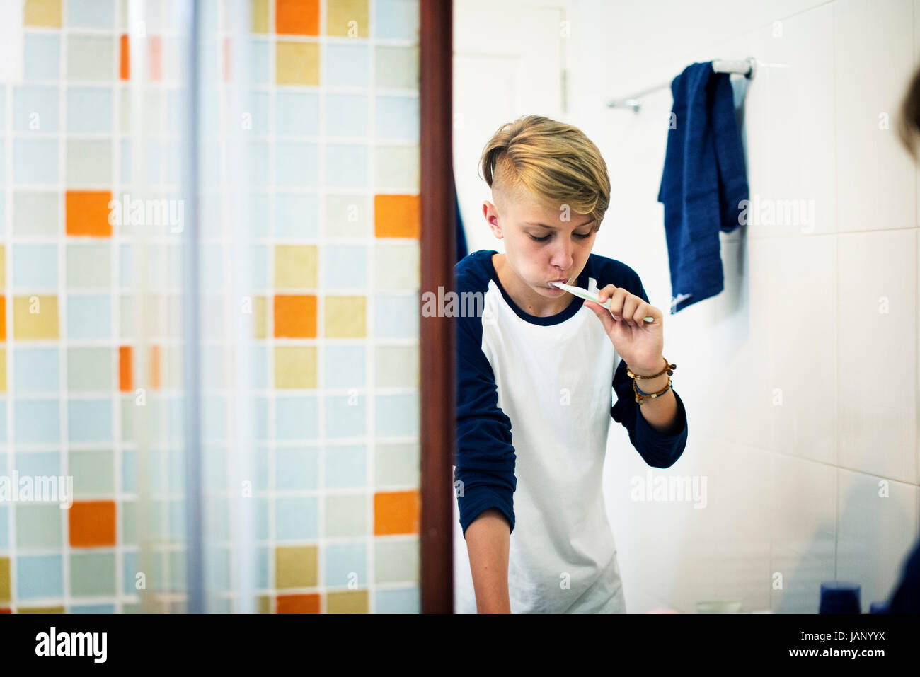 Teen boy brushing teeth hi-res stock photography and images - Alamy