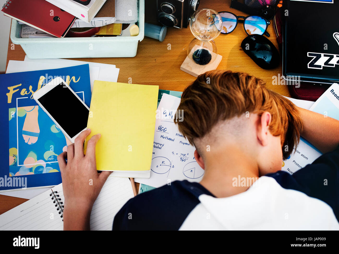 Young caucasian boy fell a sleep while doing homework Stock Photo - Alamy