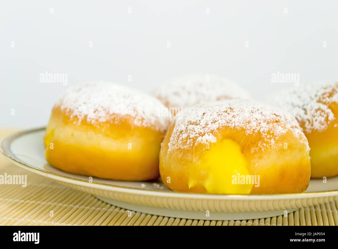 cluster of donuts on a white plate Stock Photo - Alamy