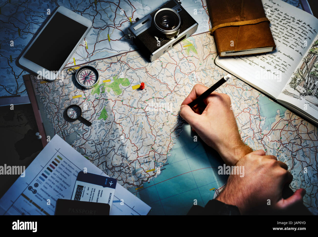 Closeup of hand tracking location on the map Stock Photo - Alamy