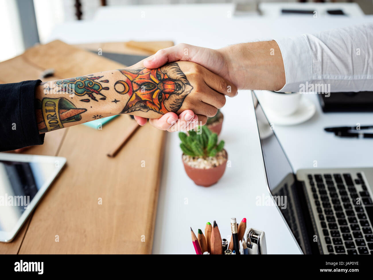 Closeup of hands shaking together collaboration Stock Photo - Alamy