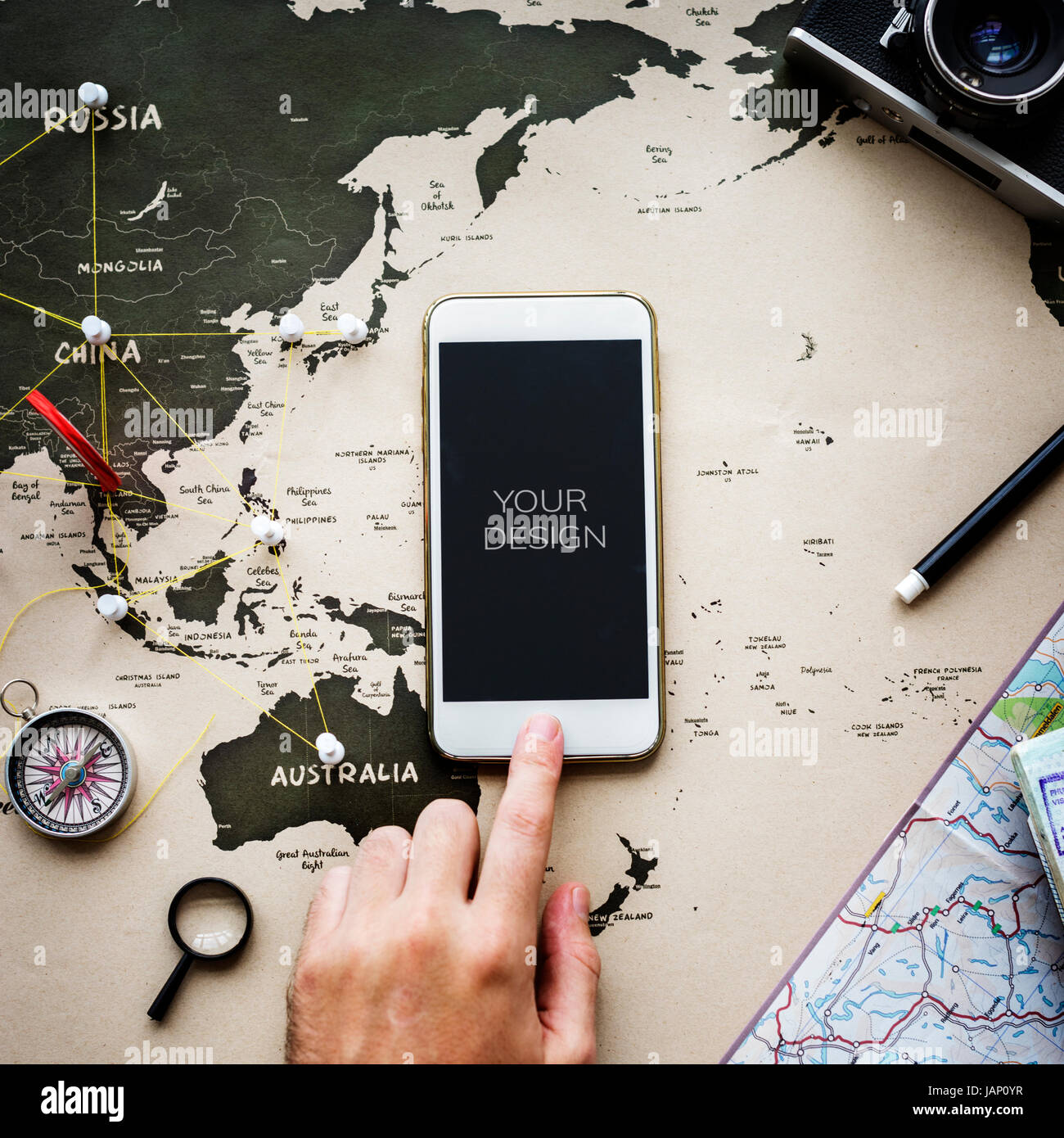 Closeup of hand with mobile phone over map background Stock Photo - Alamy