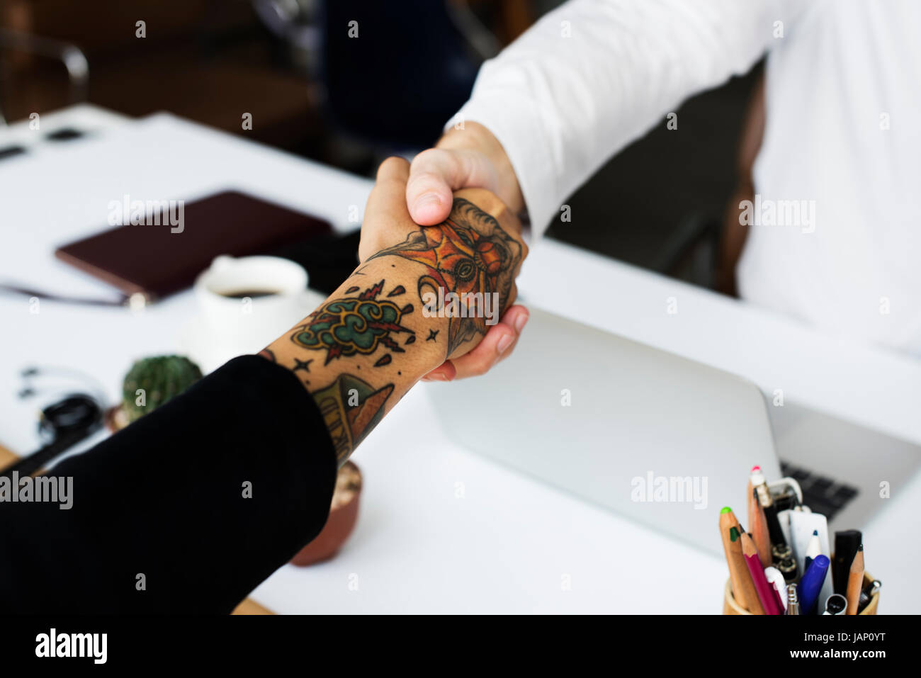 Closeup of hands shaking together collaboration Stock Photo - Alamy