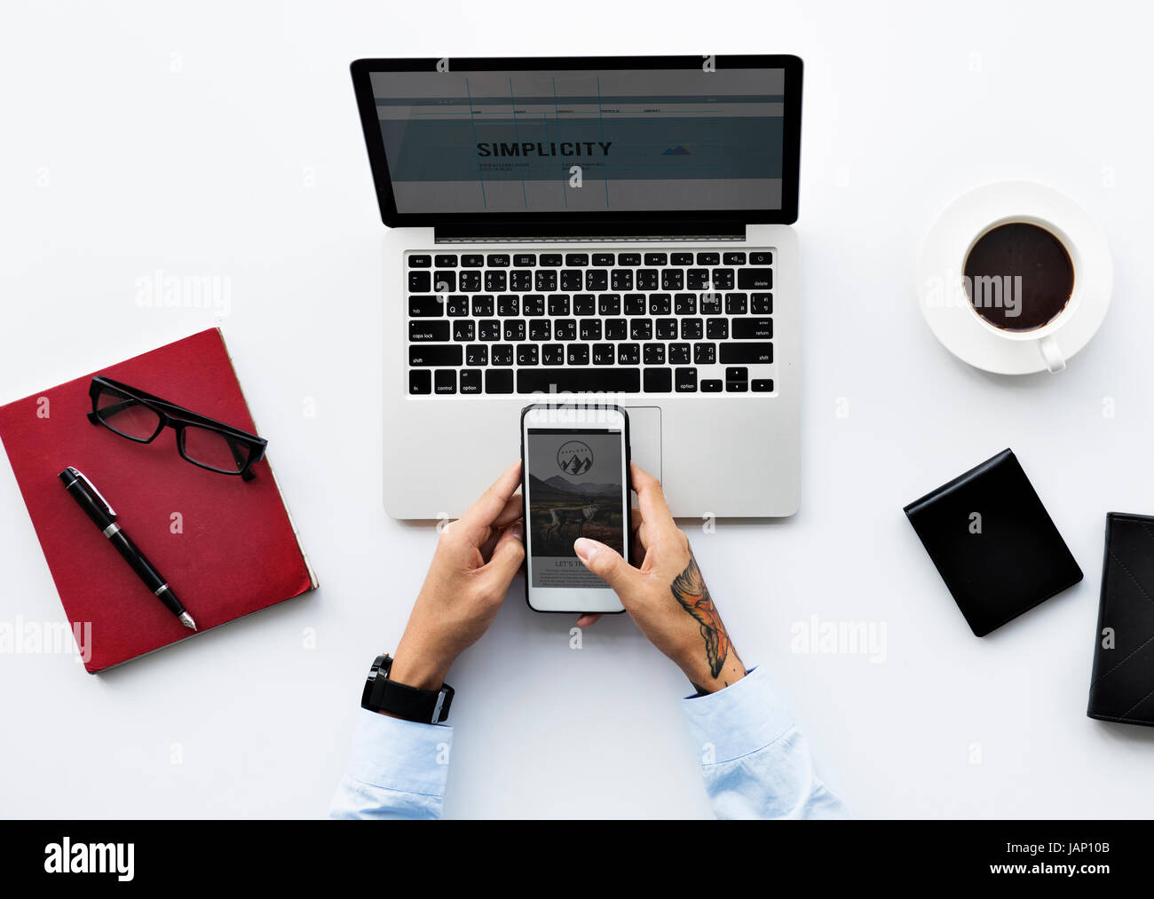 Aerial view of businessman using mobile phone with computer laptop ...
