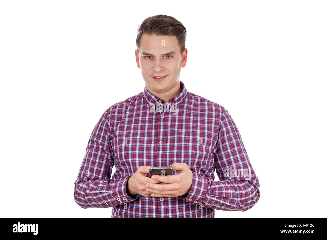 Picture of a young man holding his smartphone Stock Photo - Alamy