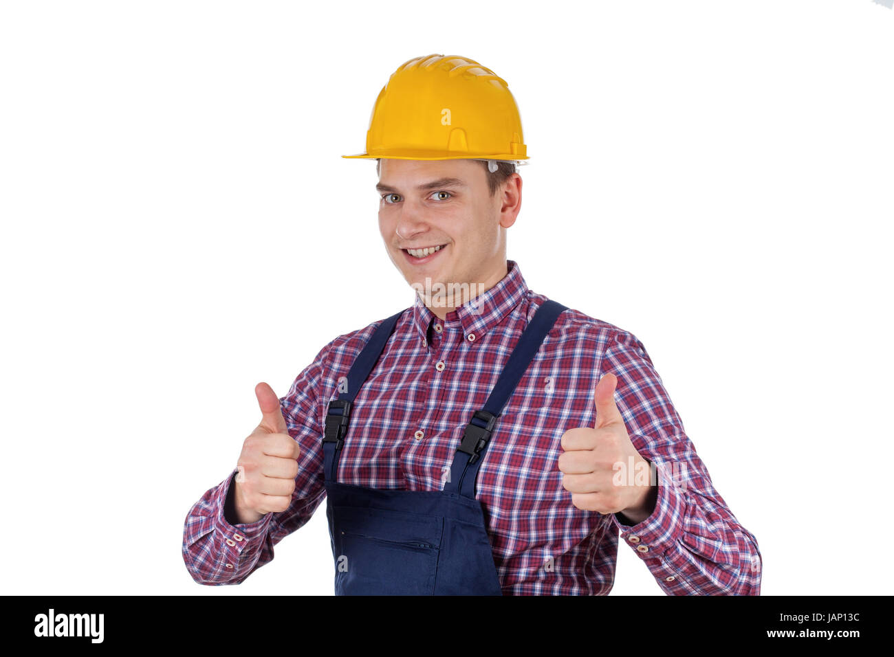 Picture of a smiling young engineer showing thumbs up Stock Photo - Alamy