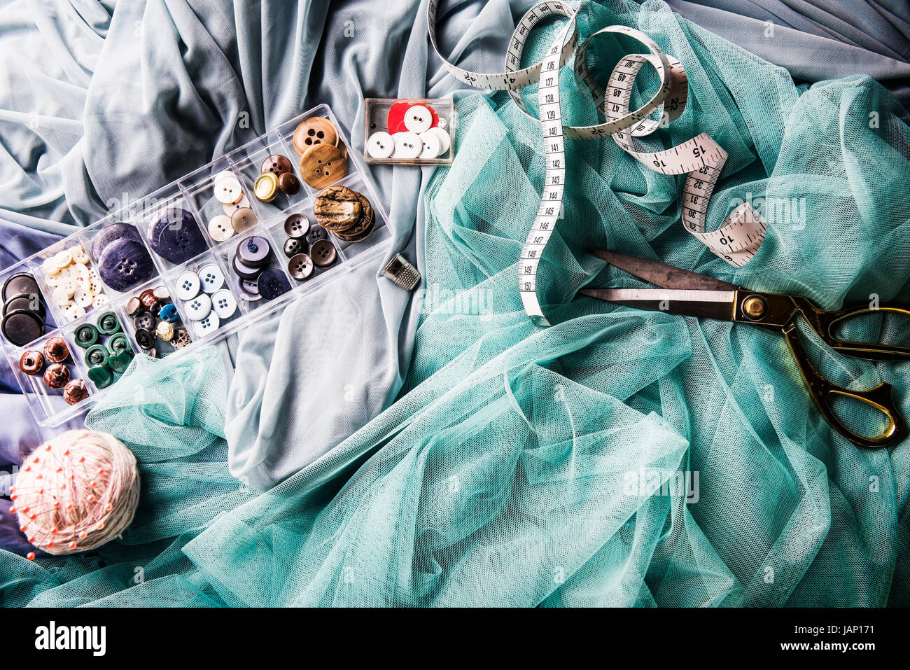 Needle cotton yarn sewing thread fabric Stock Photo - Alamy