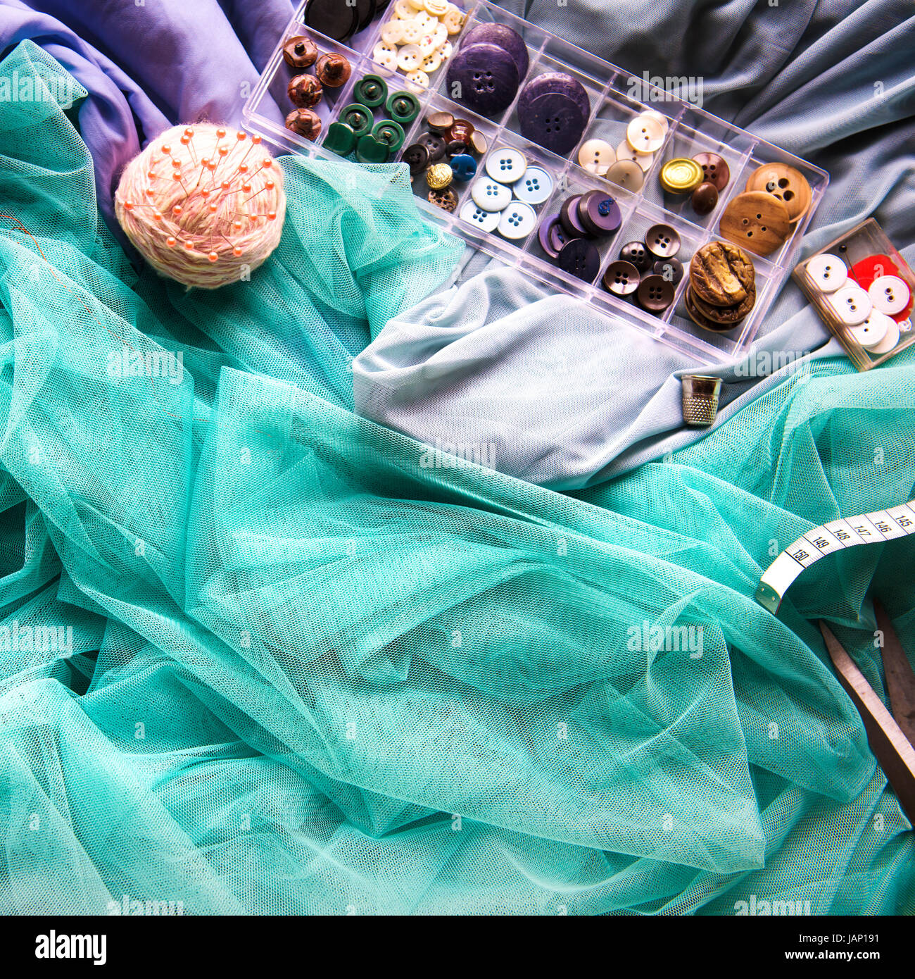 Needle cotton yarn sewing thread fabric Stock Photo - Alamy