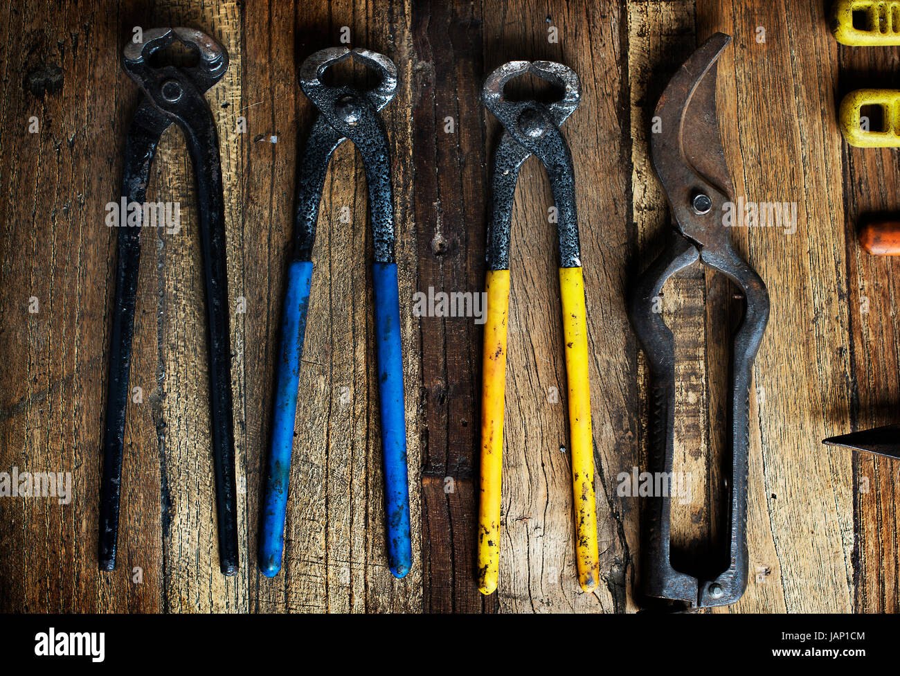 Aerial view of pliers set on wooden table Stock Photo - Alamy