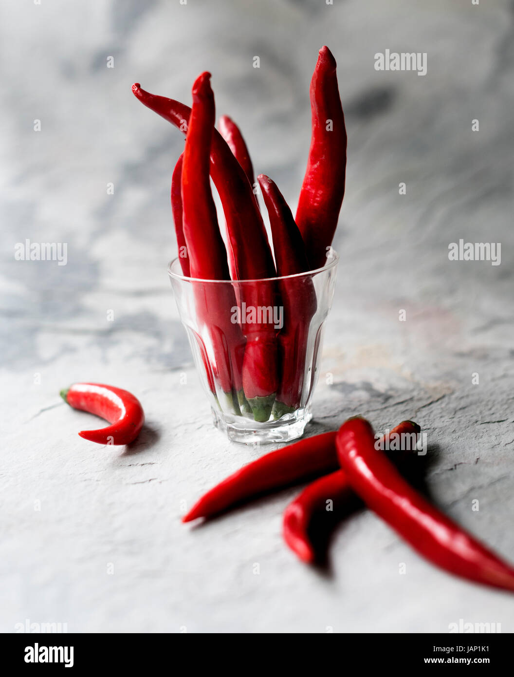 Aerial view of cayenne chili peppers in glass Stock Photo - Alamy