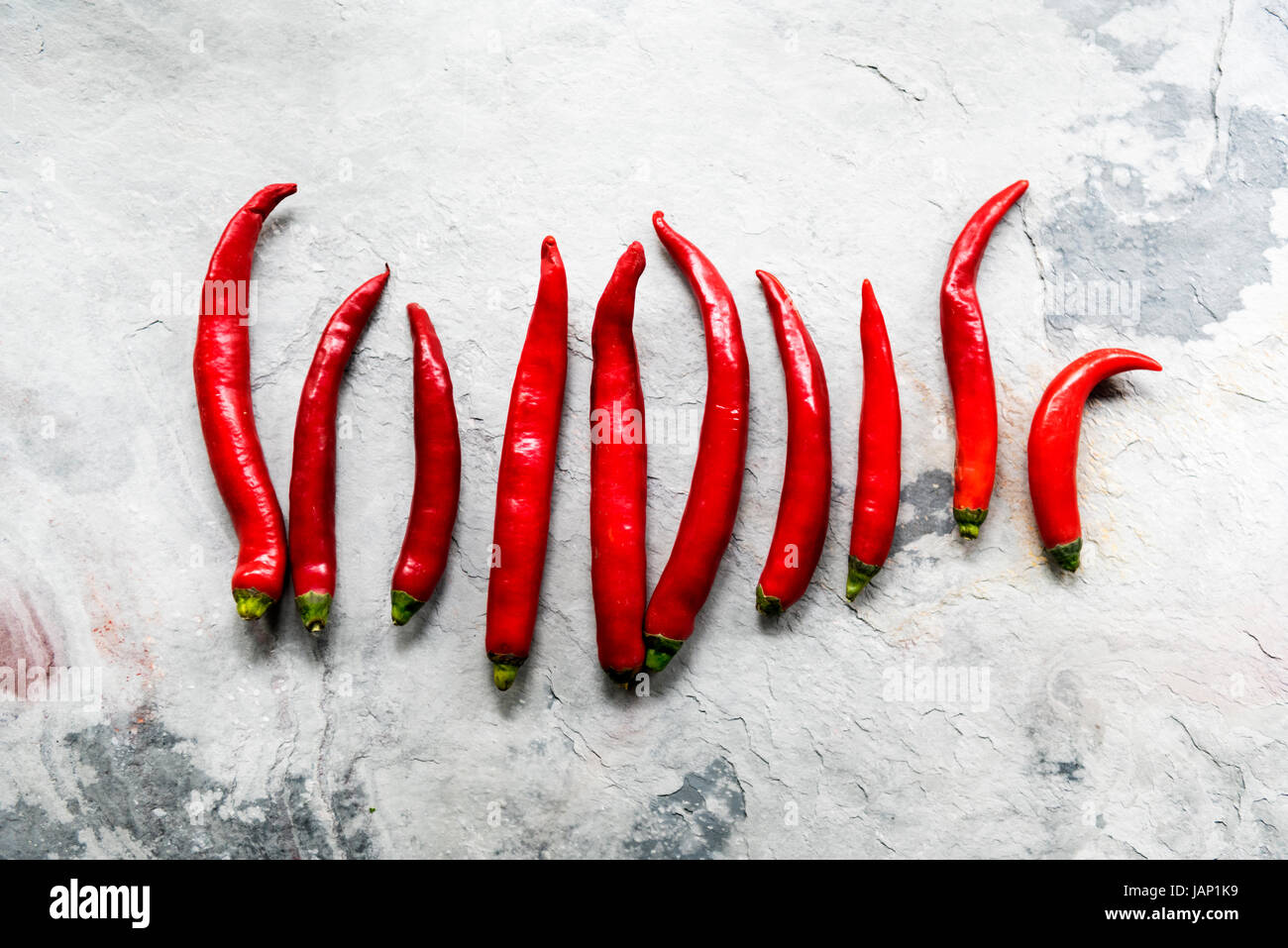 Aerial view of cayenne chili peppers on grunge background Stock Photo ...