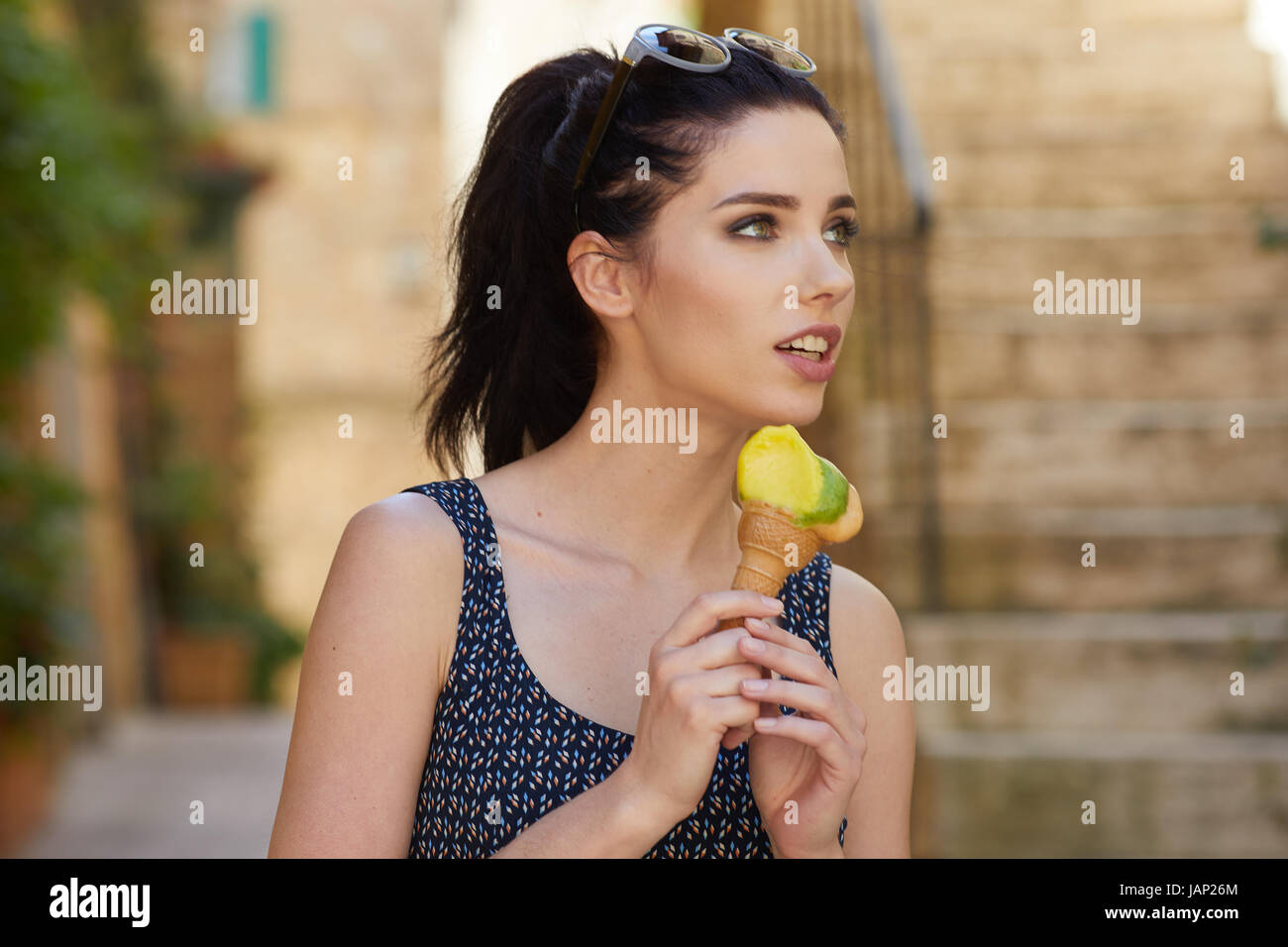 Portrait of italian woman, eating ice-cream outdoor, Tuscany, Italy ...